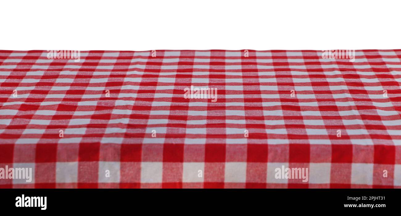Table with checkered picnic cloth isolated on white Stock Photo - Alamy