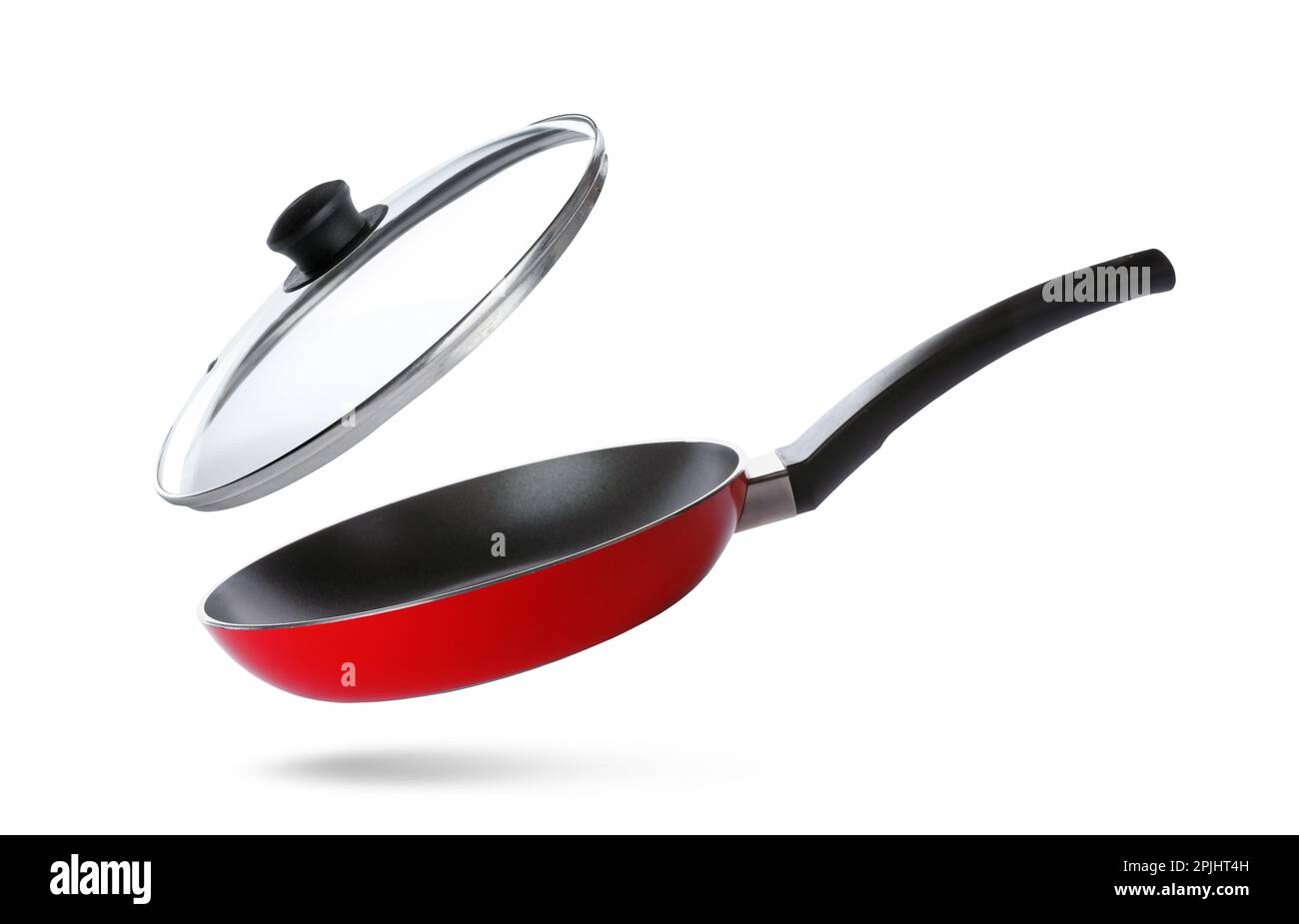 New frying pan and glass lid on white background Stock Photo - Alamy