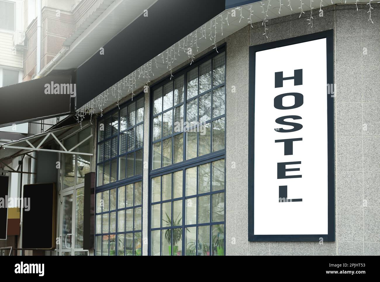 HOSTEL sign board on building facade outdoors Stock Photo - Alamy