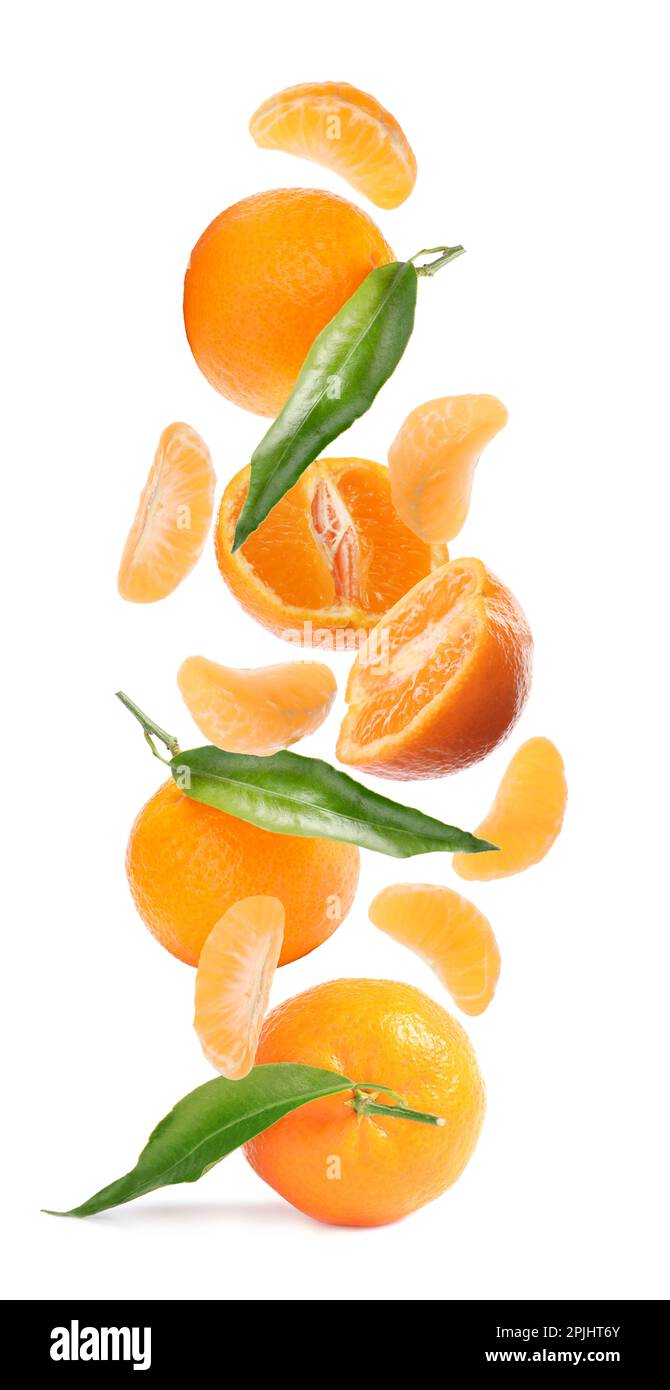 Tasty fresh tangerines falling on white background Stock Photo - Alamy