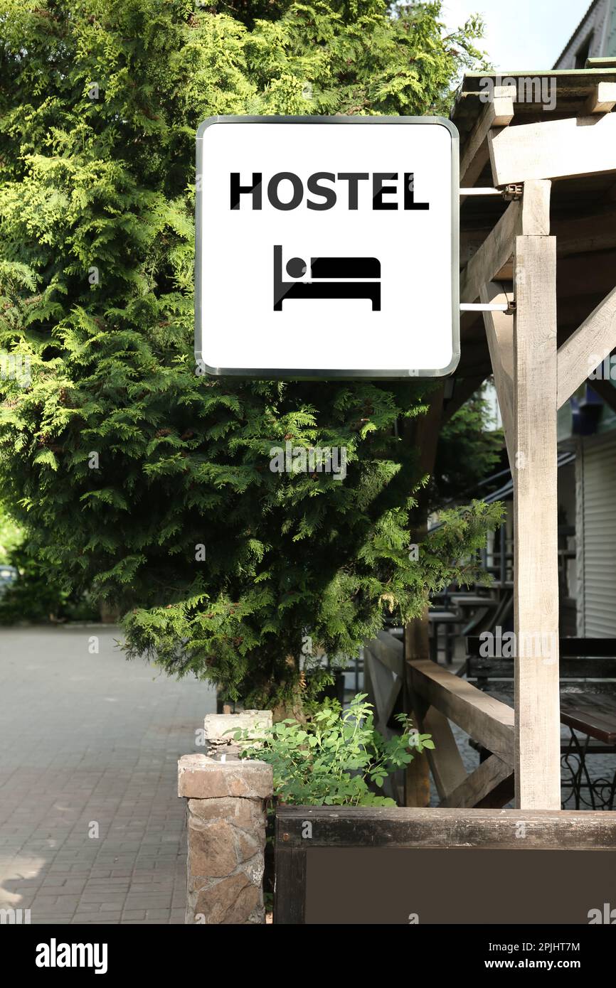 HOSTEL lightbox sign near building on city street Stock Photo - Alamy