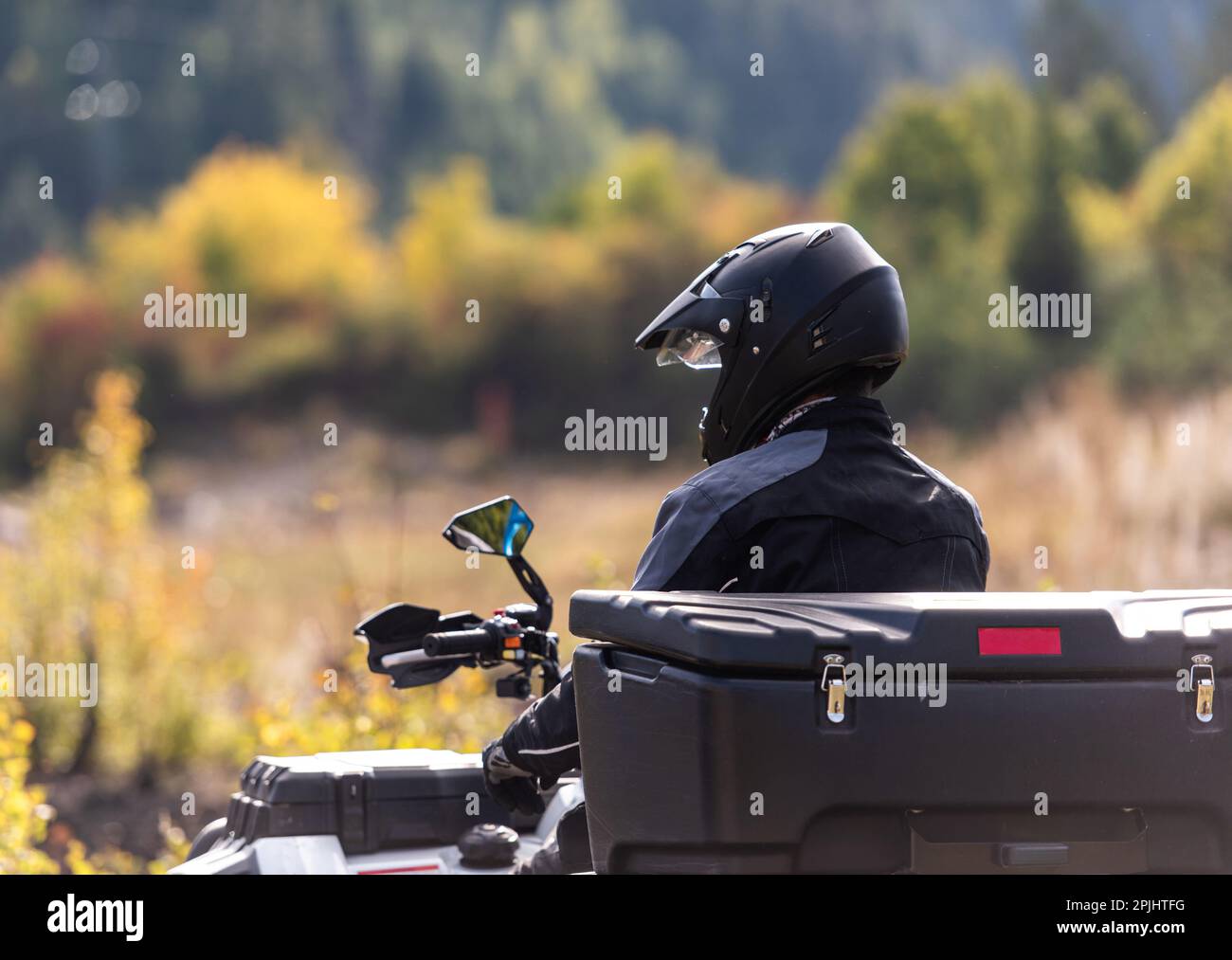 Adventurous driving of ATV motorbikes. A man drives a quad bike on ...