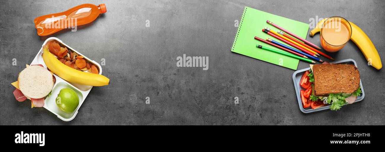 Flat lay composition with lunch box and tasty food for school on grey ...