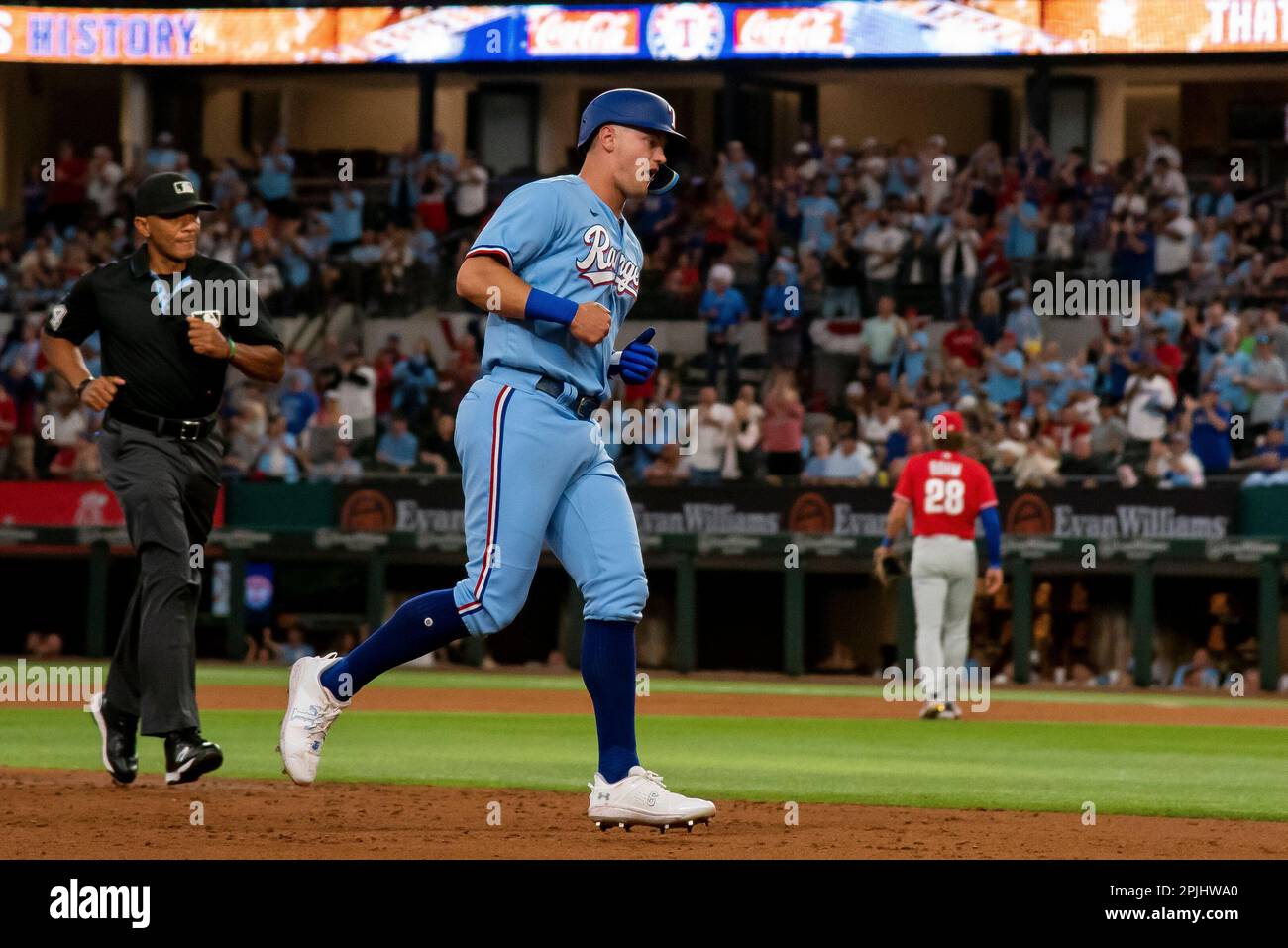 Texas Rangers' Josh Jung, center, rounds the bases after hitting a solo ...