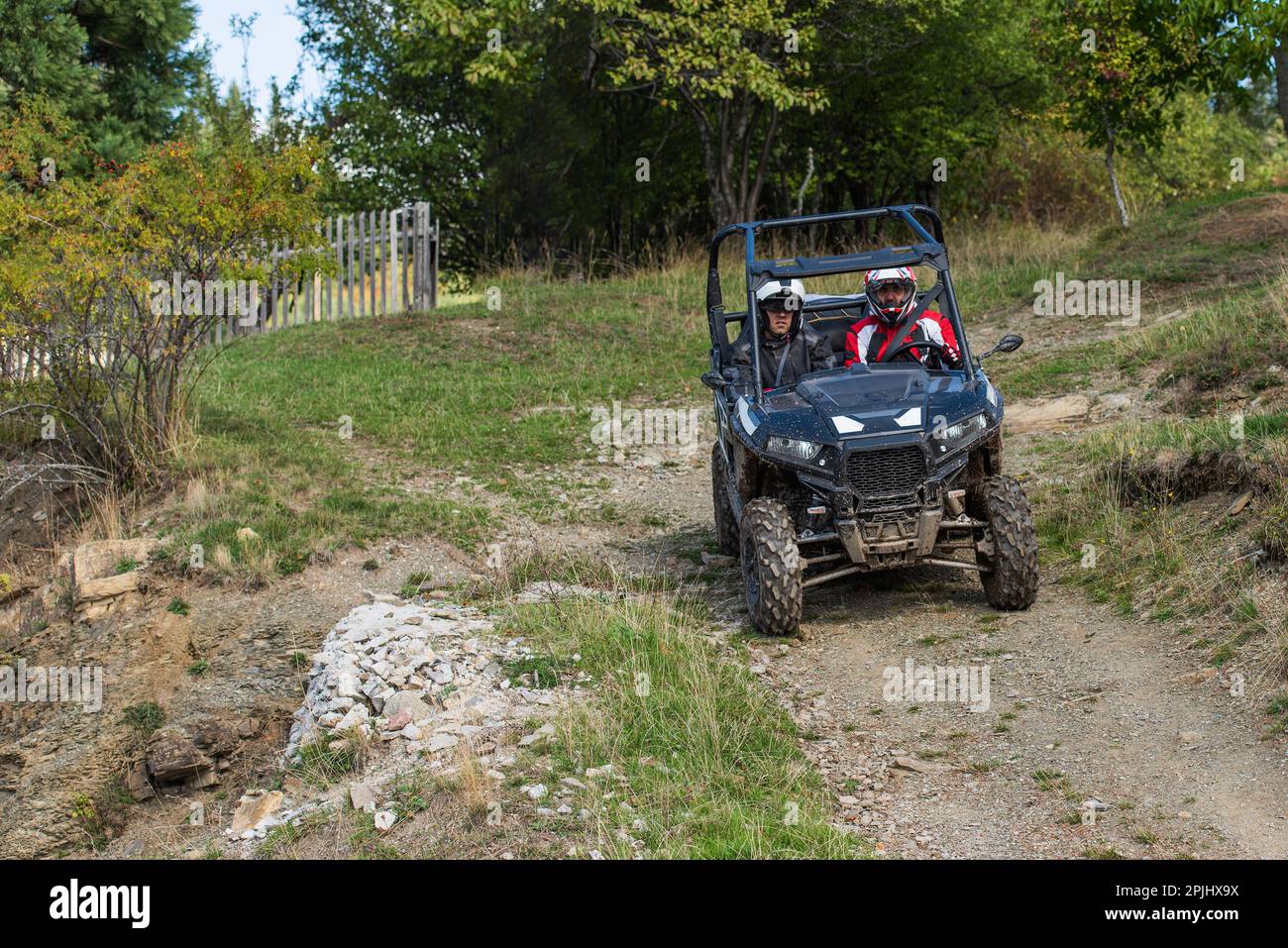 Adventurous driving of ATV motorbikes. A man drives a quad bike on ...