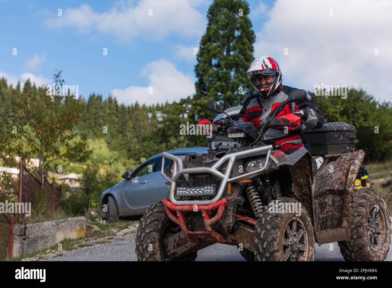 Adventurous driving of ATV motorbikes. A man drives a quad bike on ...