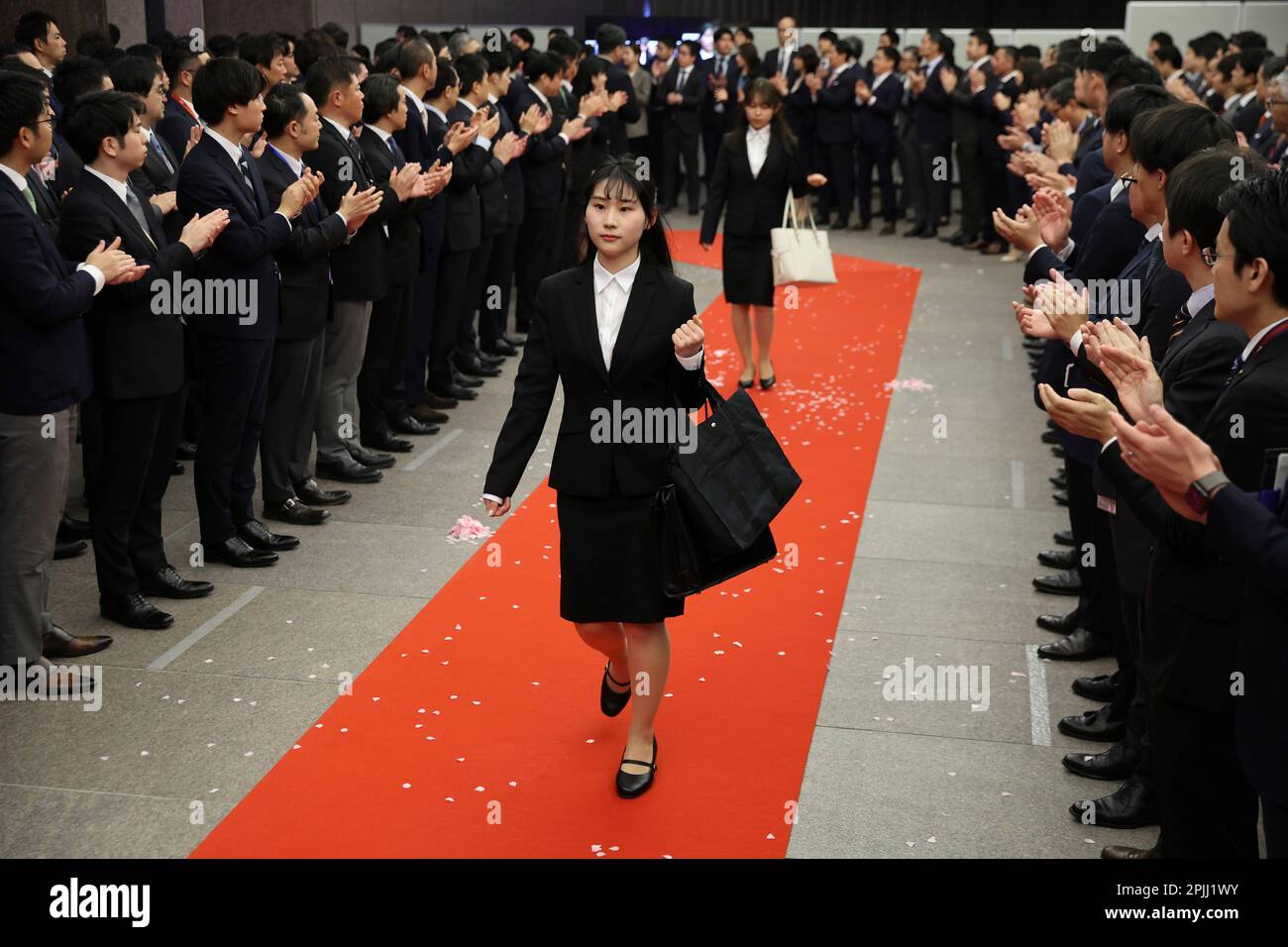 New employees attend an entrance ceremony at Itochu Co. headquarter in ...