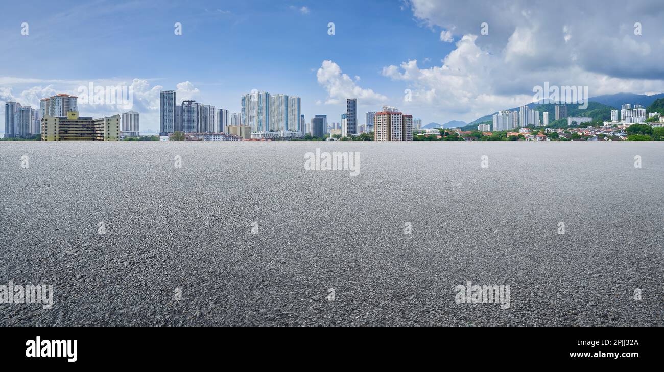 Empty asphalt floor with cityscape background Stock Photo - Alamy