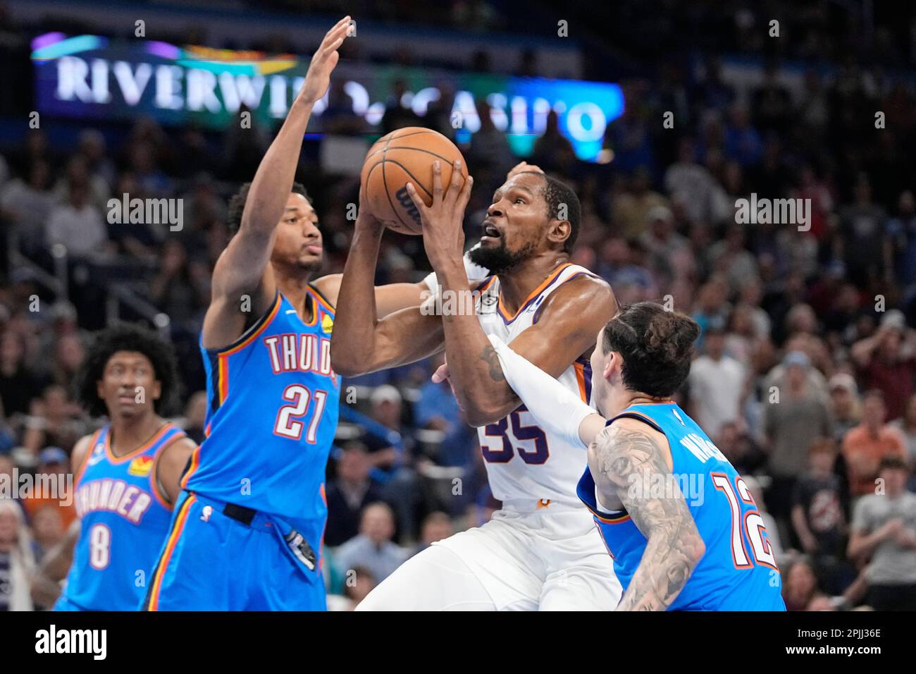 Phoenix Suns forward Kevin Durant (35) is fouled by Oklahoma City Thunder forward Lindy Waters ...