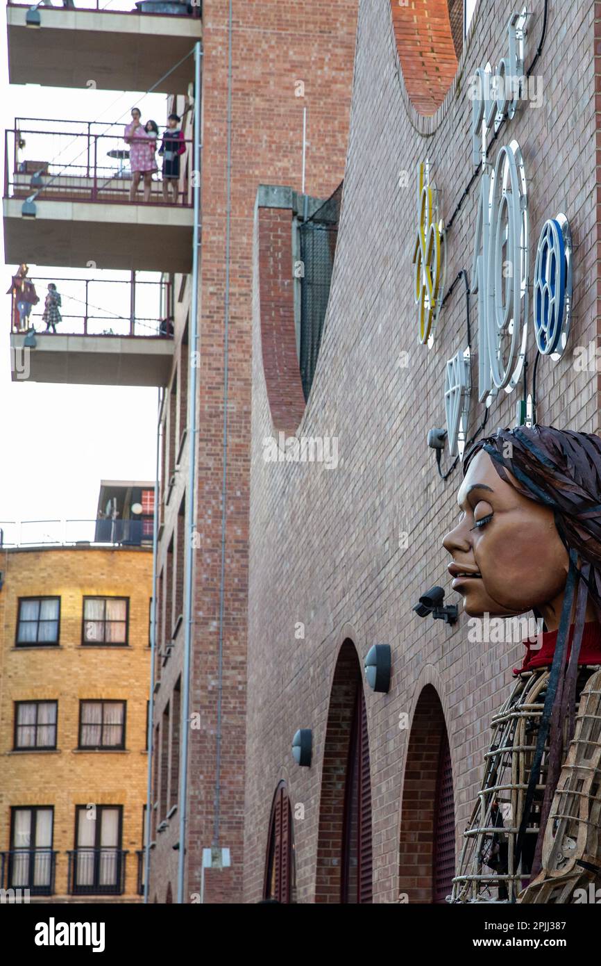 London, UK. 2nd April, 2023. Local residents observe Little Amal, a 12 ...