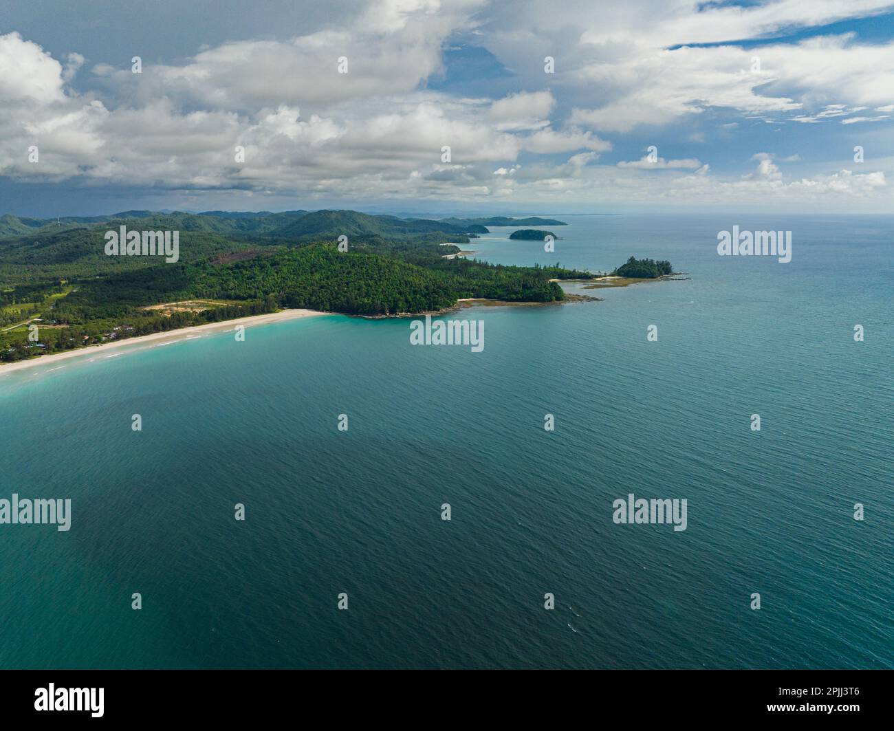 Aerial view of Borneo island covered with rainforest and sandy beach ...