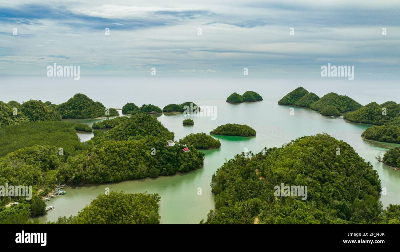 Limestone hills in a beautiful bay. Lagoon with tropical islands ...