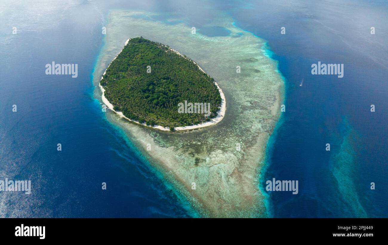 Aerial view of tropical island with a beach in the ocean. Beautiful ...