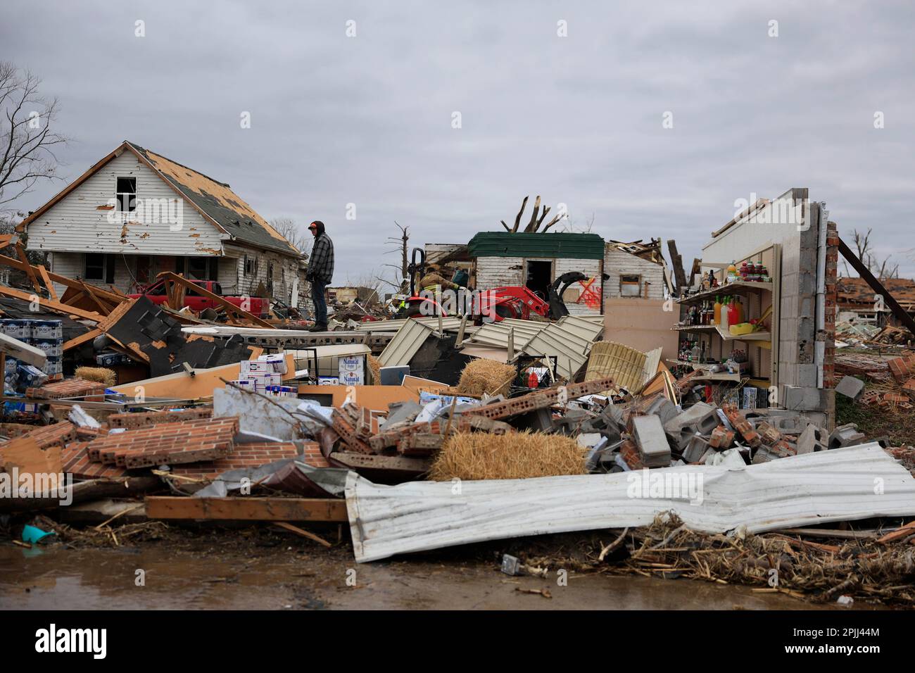 SULLIVAN, INDIANA - APRIL 1: A worker guards a liquor store against ...