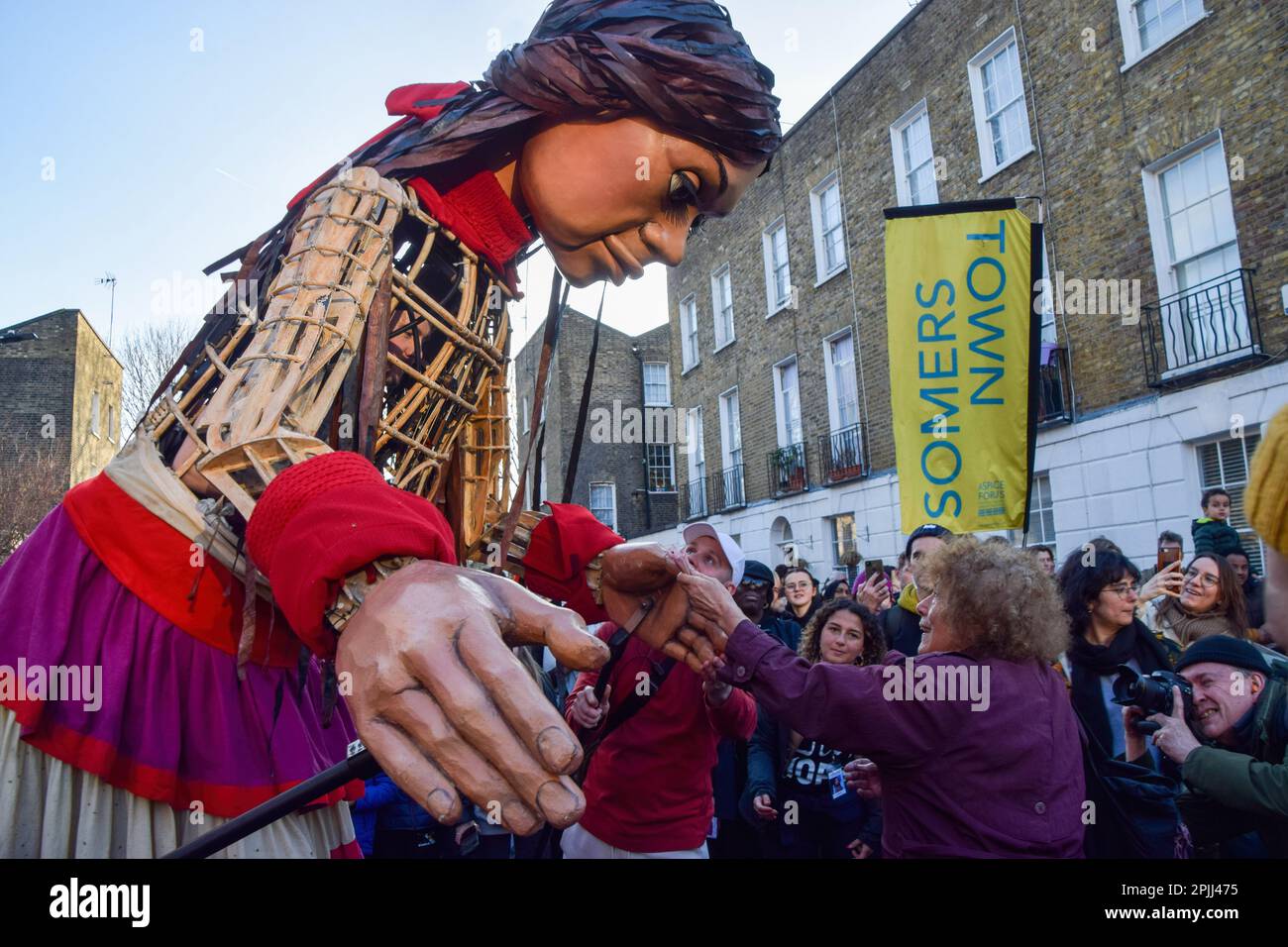 London, UK. 02nd Apr, 2023. Crowds flock around Little Amal, the 3.5 ...