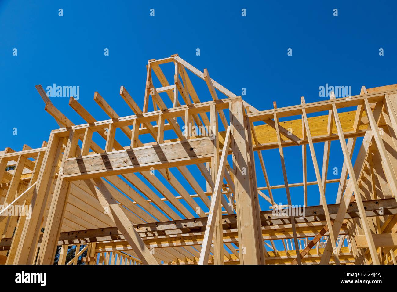New residential under construction beams framing structure home wooden ...