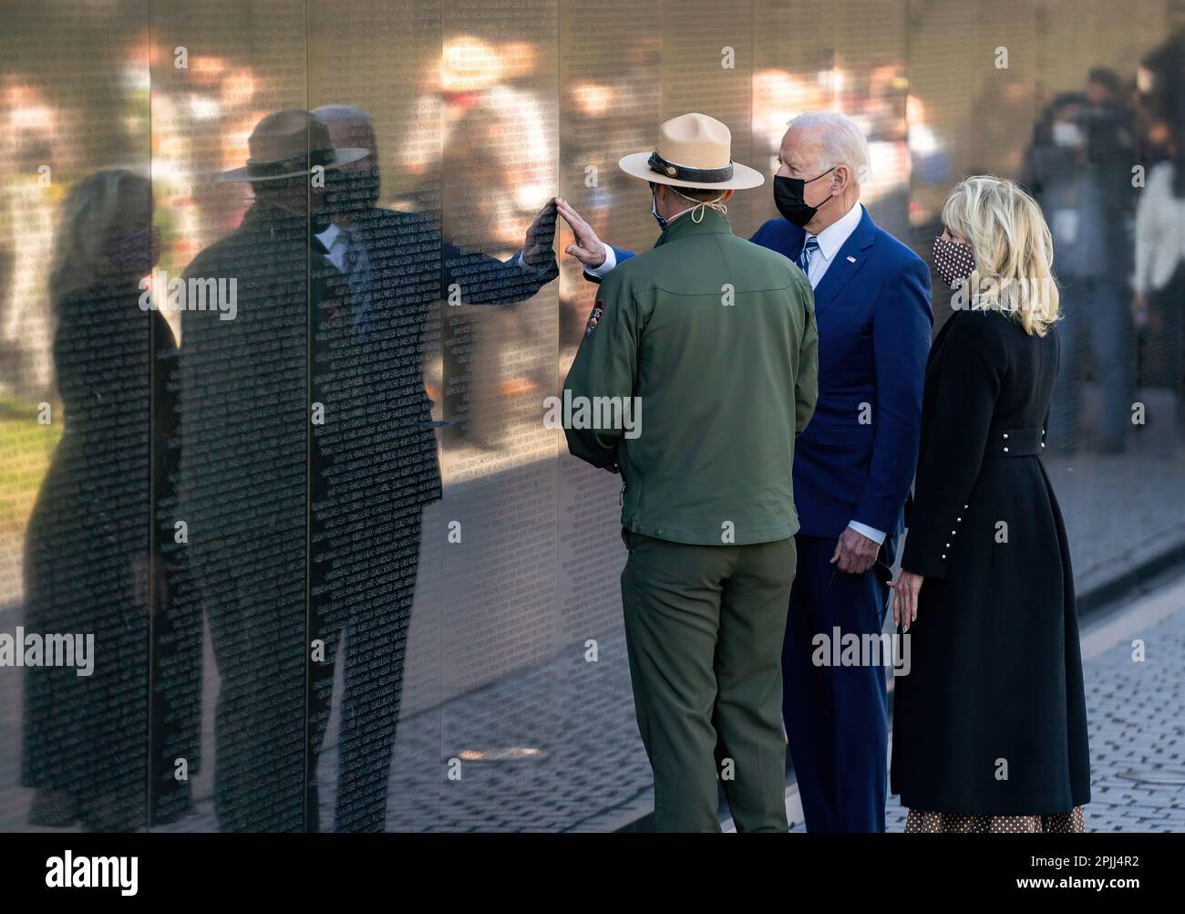 President Joe Biden and First Lady Jill Biden talks with a U.S ...