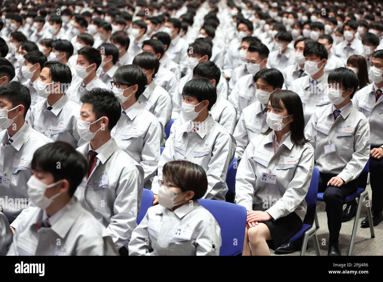 New employees of Toyota Co. attend an entrance ceremonyin Toyota City ...