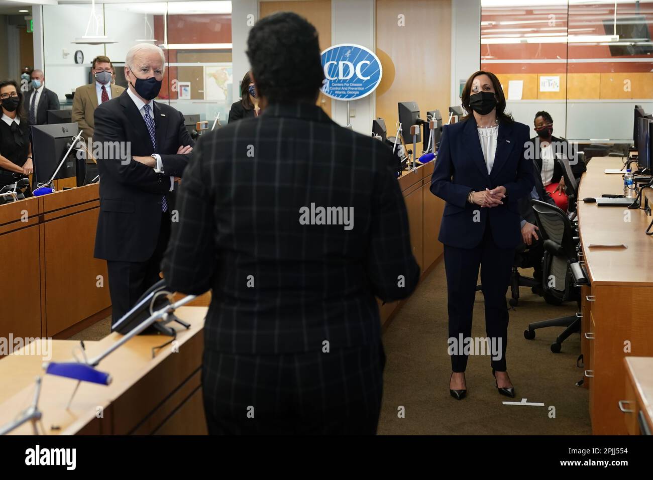President Joe Biden and Vice President Kamala Harris listen to Dr ...