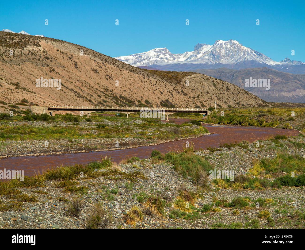 Atuel river with the snowy Andes mountains in the distance, El Sosneado ...