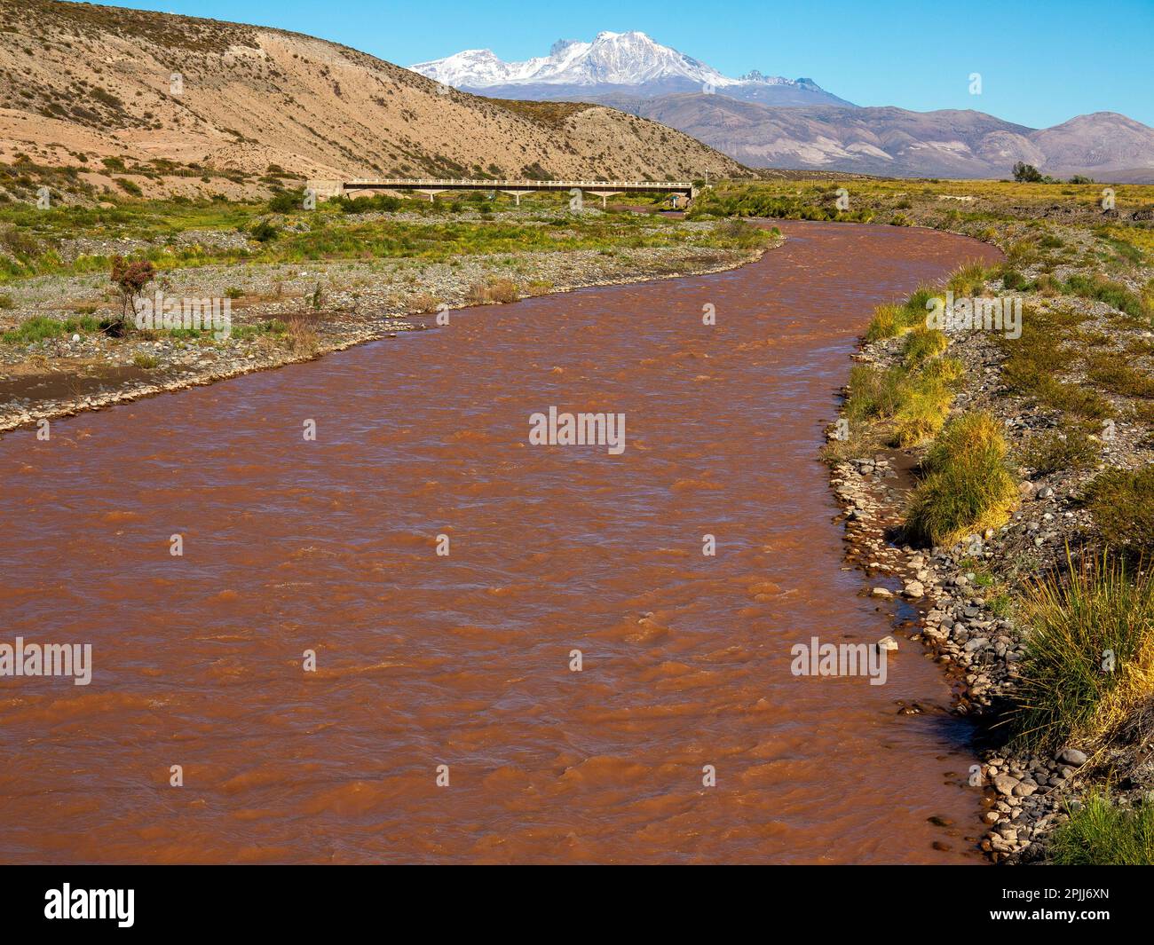 Atuel river with the snowy Andes mountains in the distance, El Sosneado ...