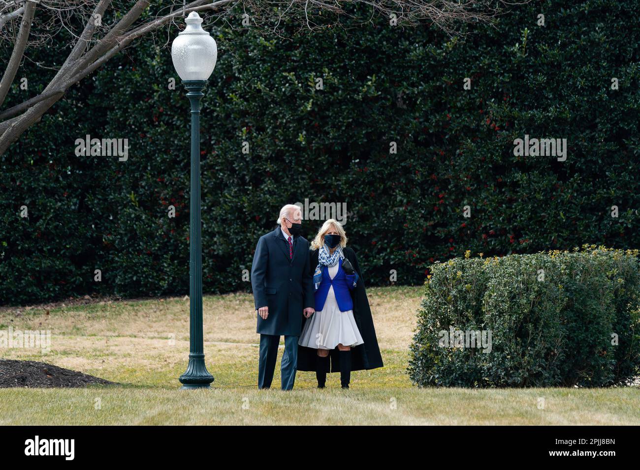 President Joe Biden and First Lady Dr. Jill Biden walk along the South ...