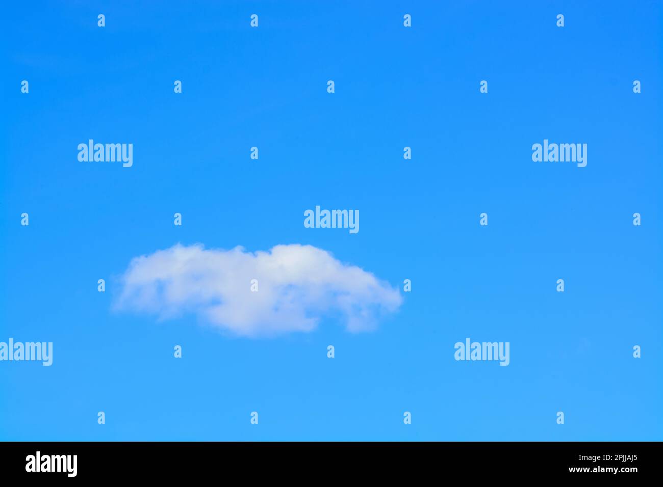 Blue sky and small white cloud in horizontal format Stock Photo - Alamy