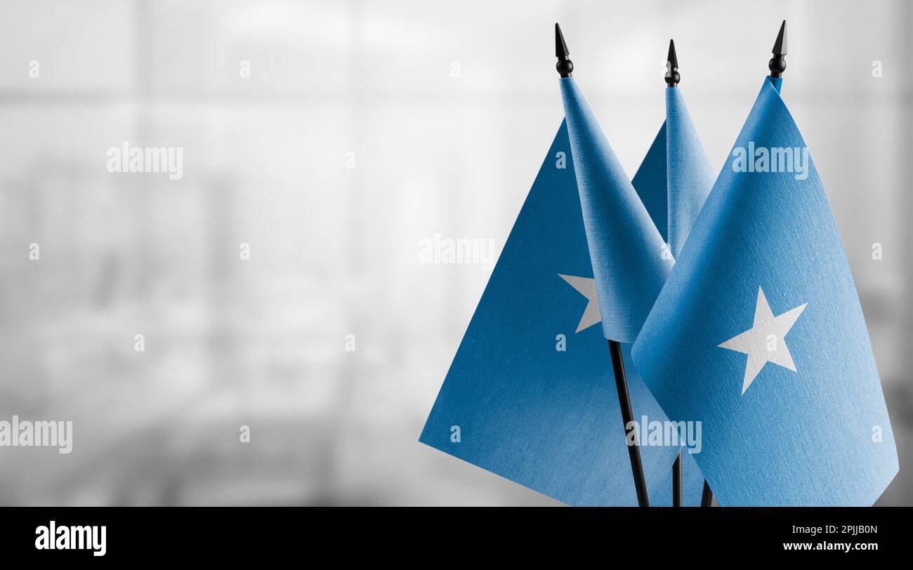 Small flags of the Somalia on an abstract blurry background Stock Photo ...
