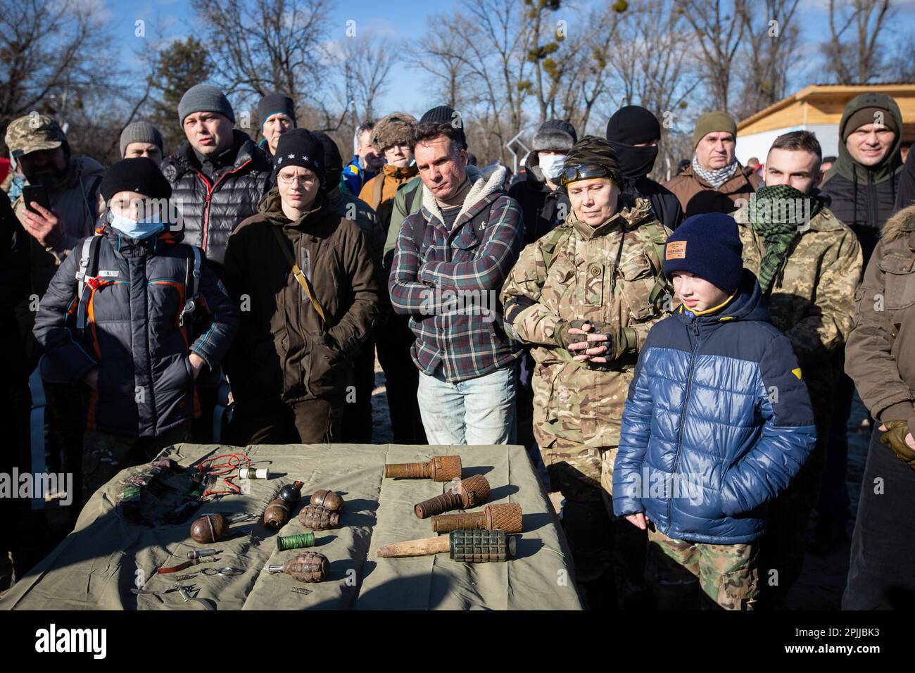 People view practice hand grenades during a training exercise for ...