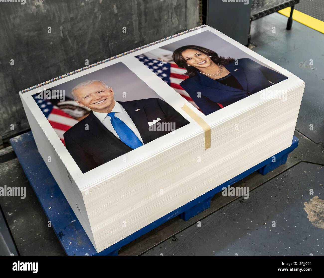 Stacks of the official portraits of President Joe Biden and Vice ...