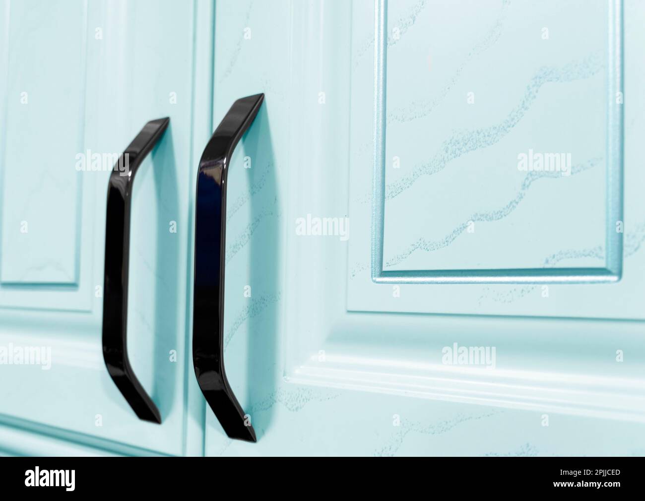 Modern kitchen interior. Handles on kitchen cabinets. Salon with ...