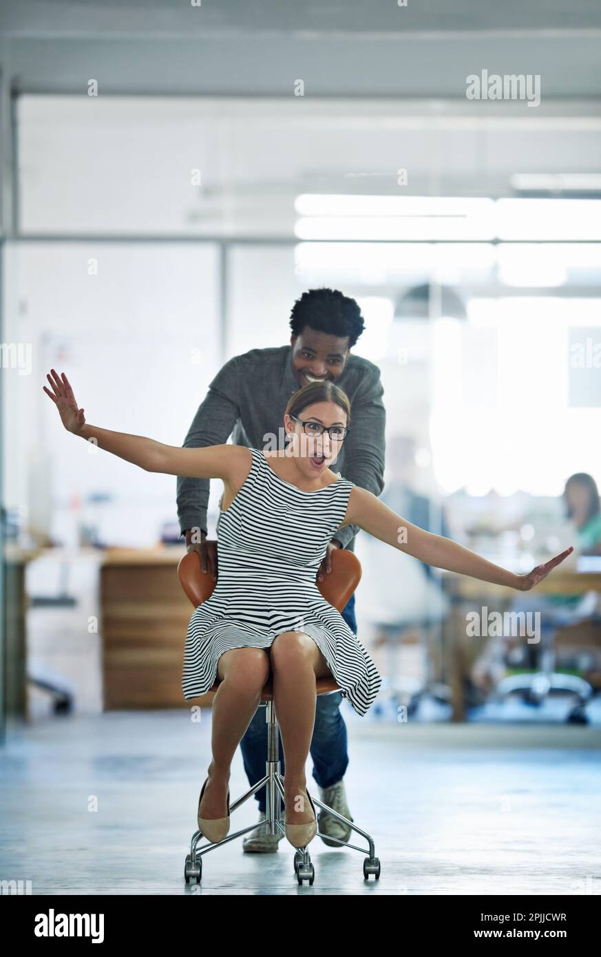 Person pushing office chair hi-res stock photography and images - Alamy