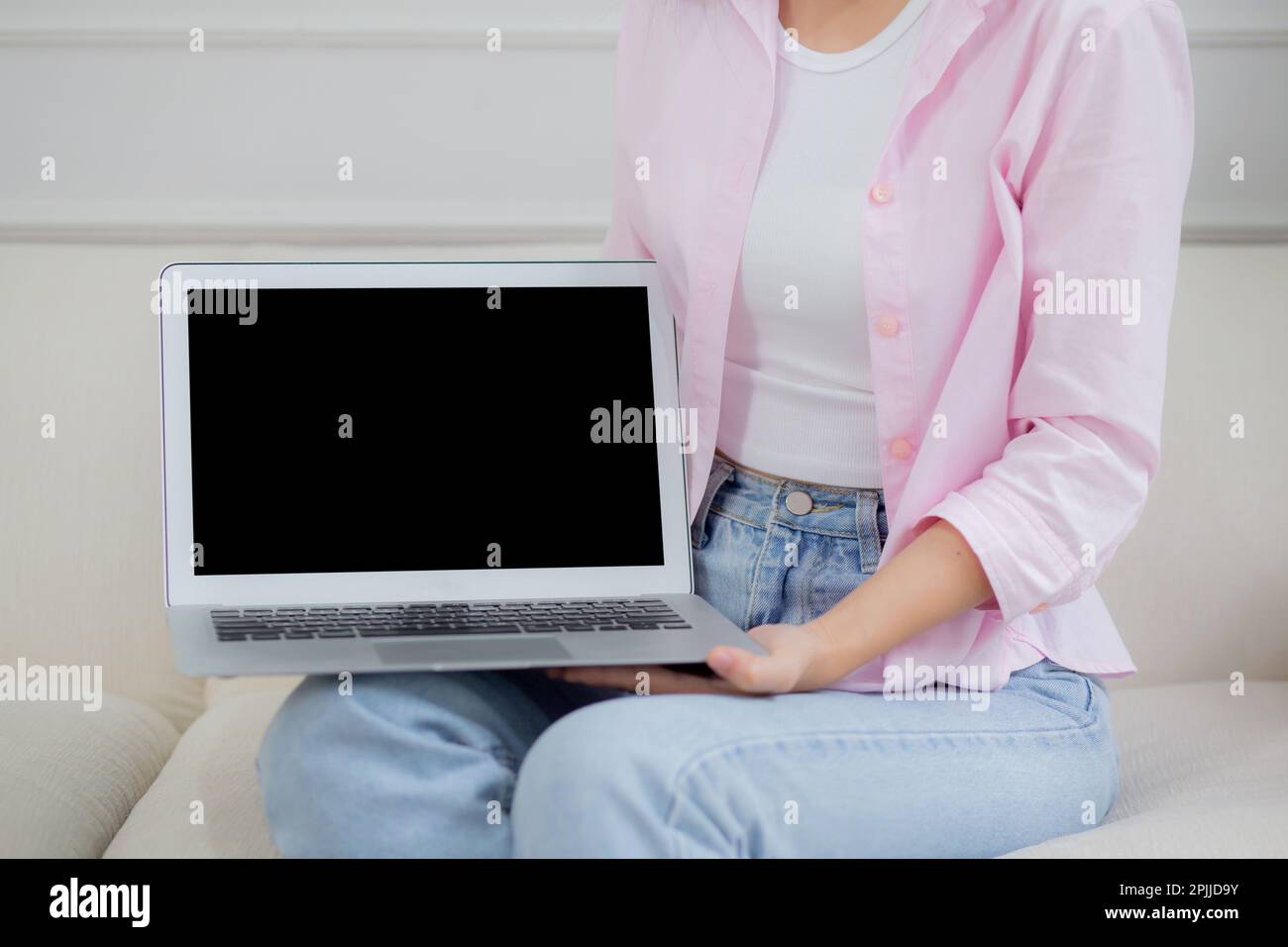 Beautiful young asian woman showing display screen mockup laptop ...