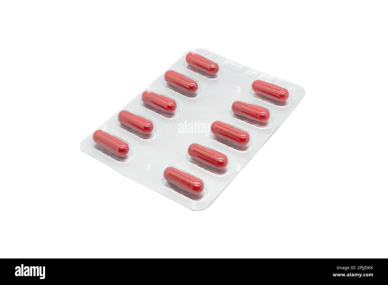 Macro shot pile of red tablets pill in silver blister packaging ...