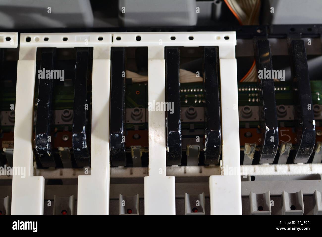 Cairo, Egypt, April 1 2023: Broken electronic musical keyboard, cracked ...