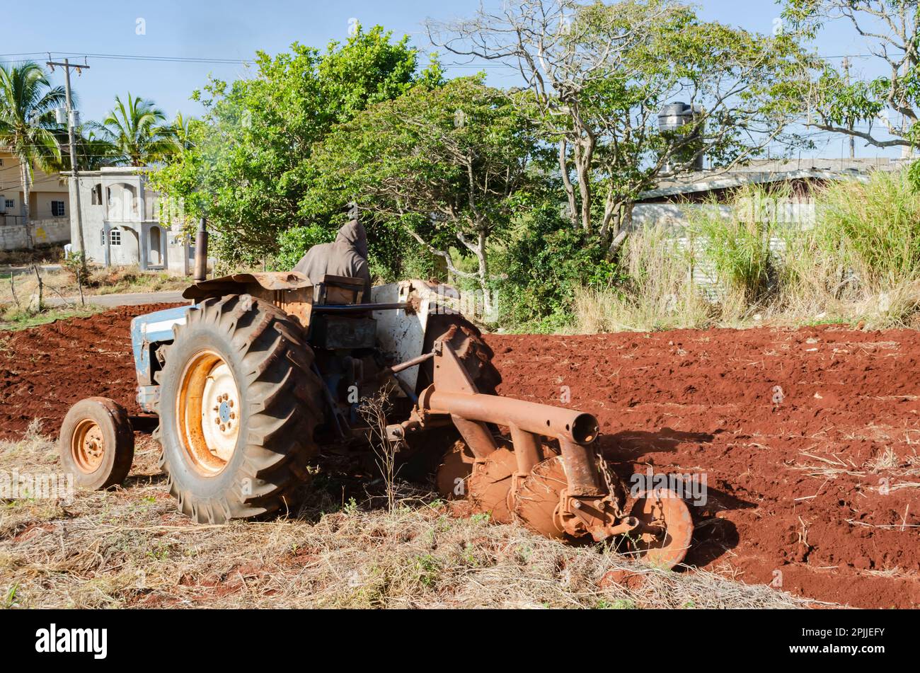 Ploughing Land For Farming Stock Photo - Alamy
