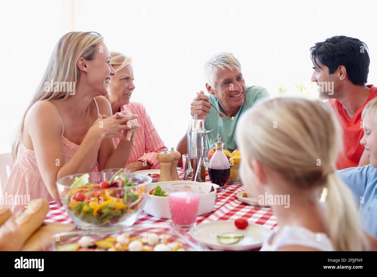 Great family bonding time. a multi-generational family having lunch ...