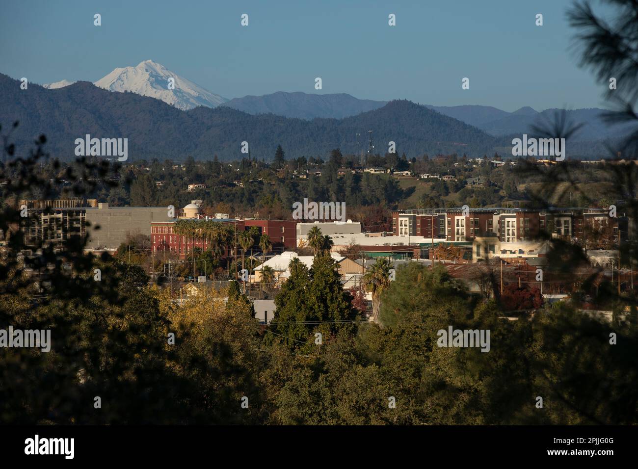 Afternoon snow covered view of the peak of Mount Shasta and the ...