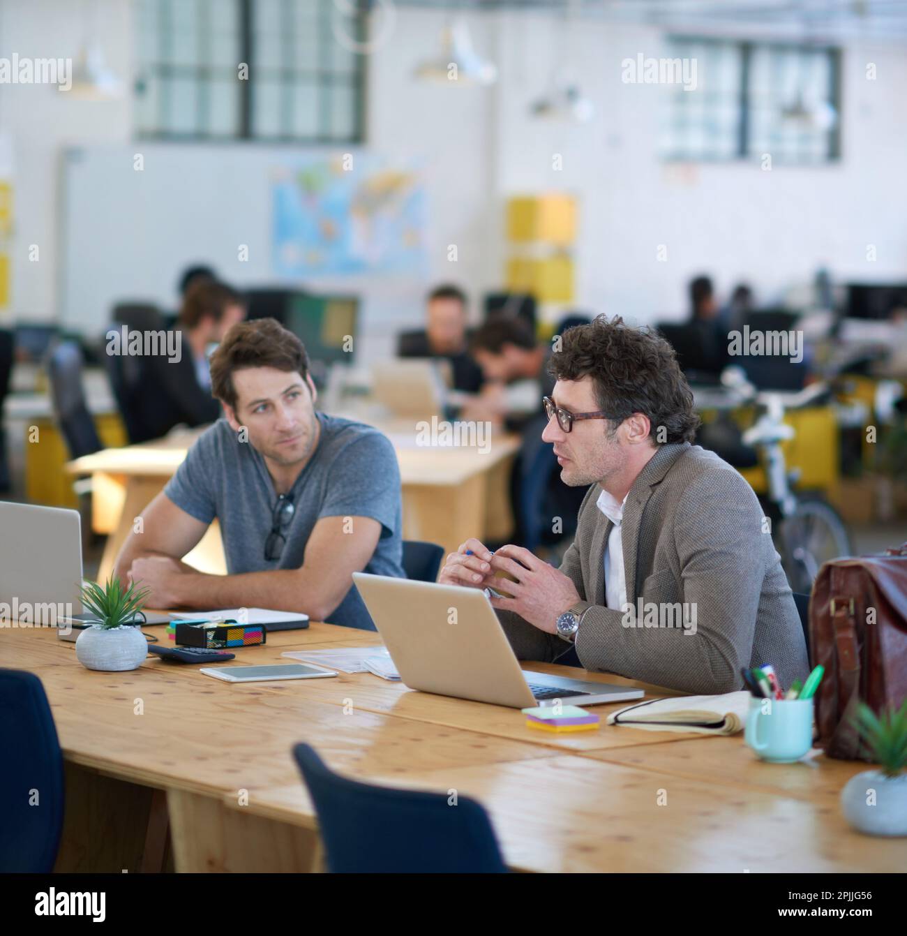 We make technology work for us. business colleagues discussing matters ...