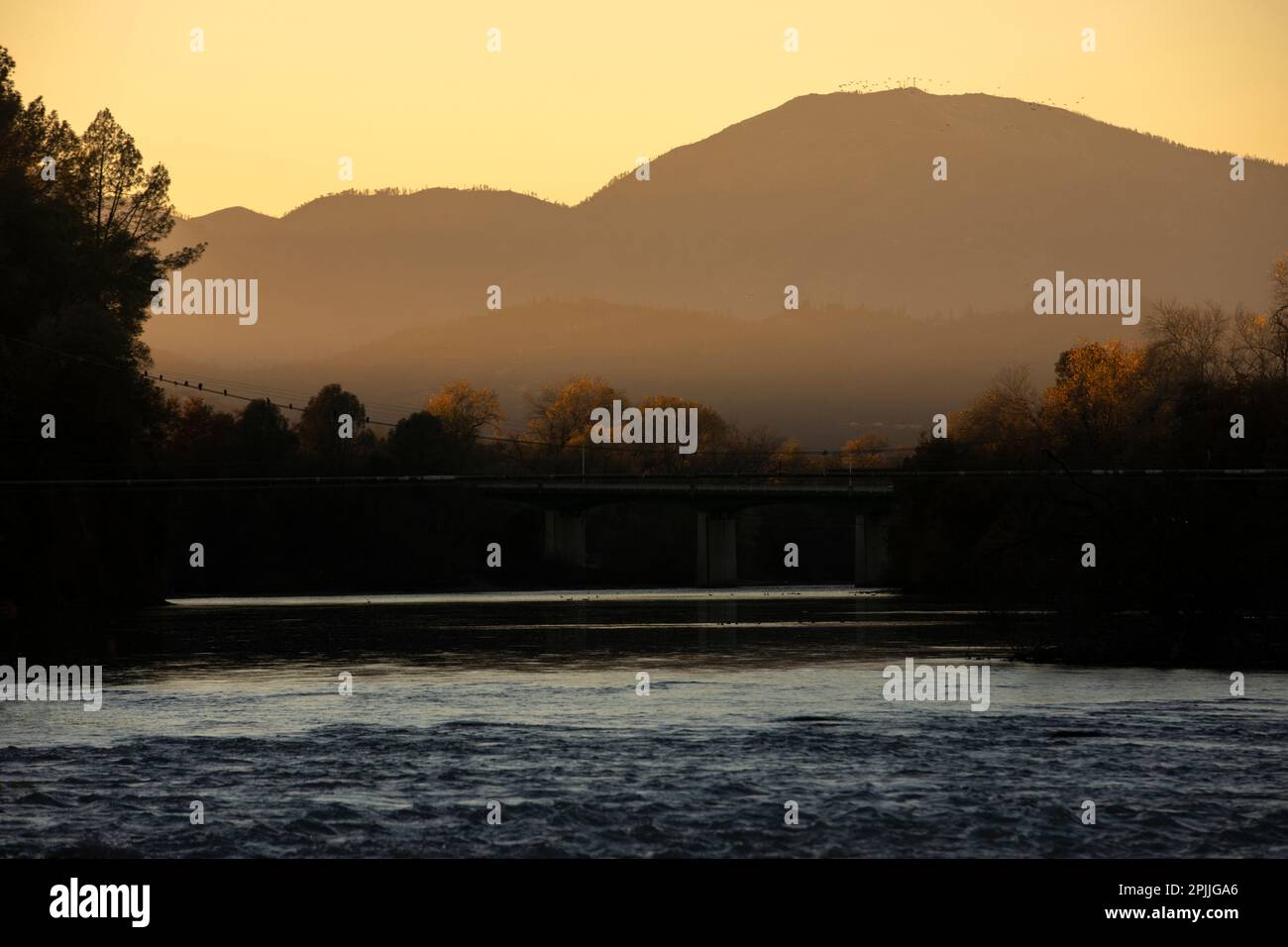 Sunset view of the Shasta Mountains and Sacramento River as it runs ...