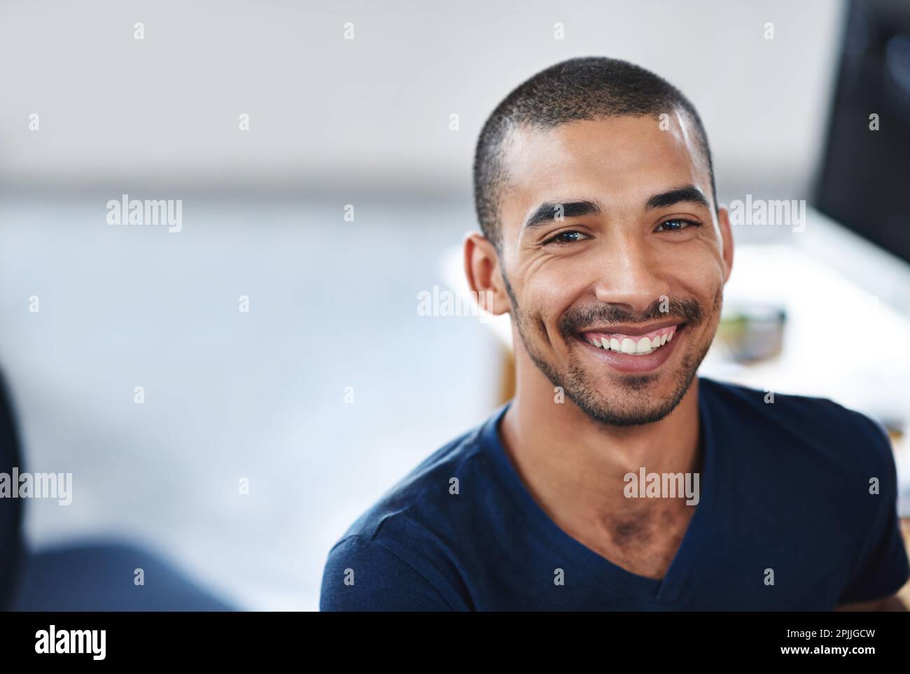 Make creativity a job. Portrait of a young designer at work on his ...