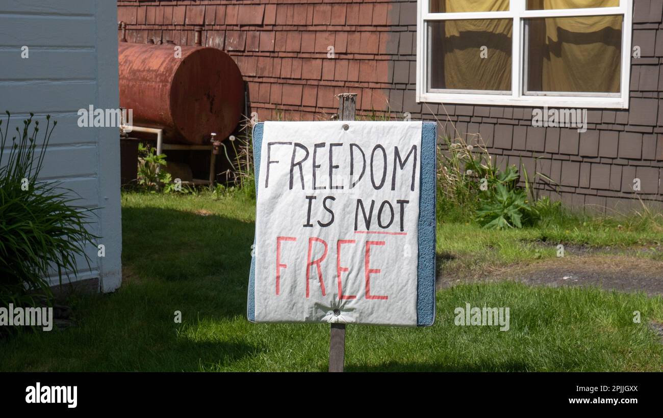 Placard with Freedom is not free inscription. Handwritten placard ...