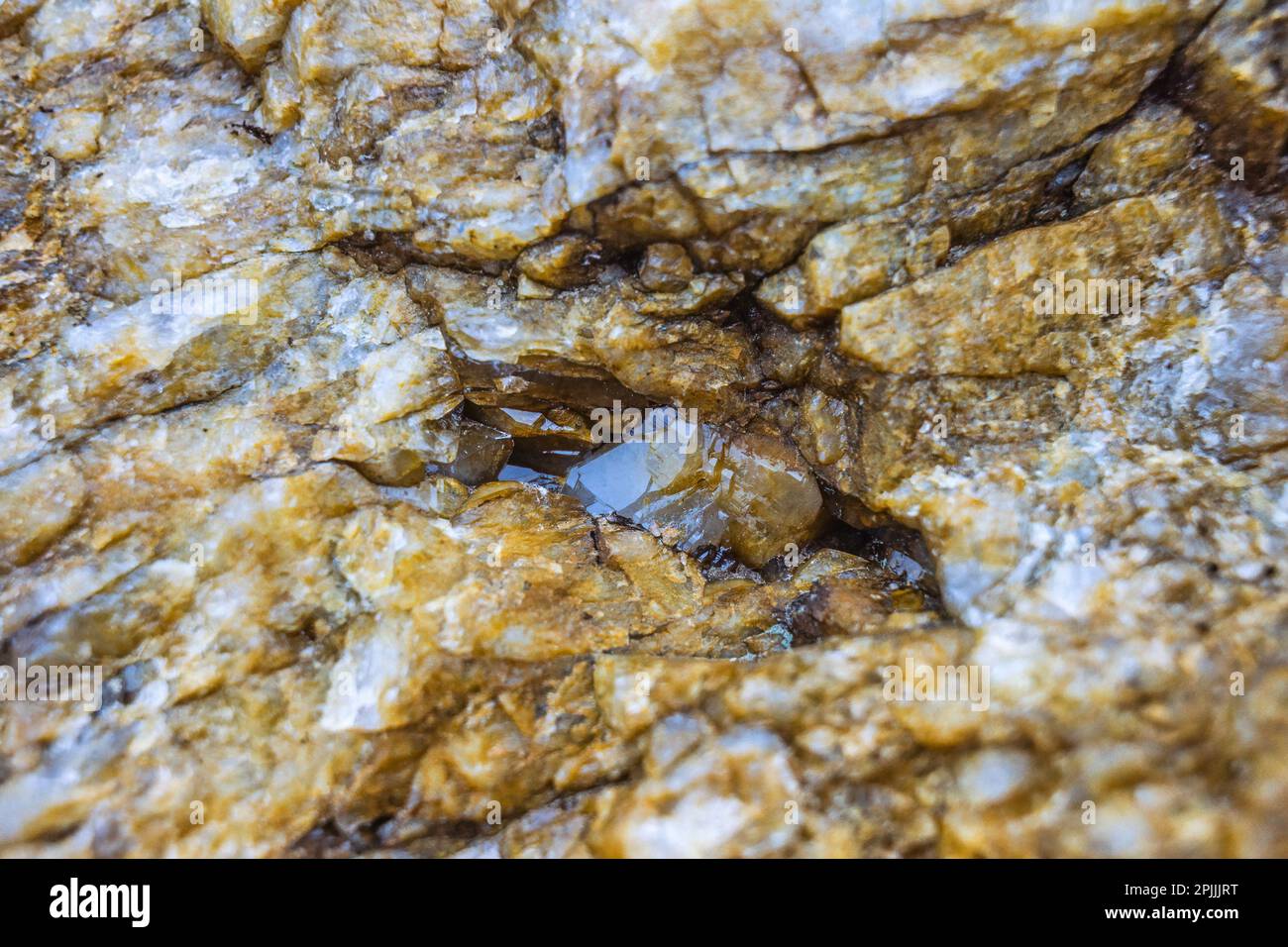Quartz stone in a natural rock Stock Photo - Alamy