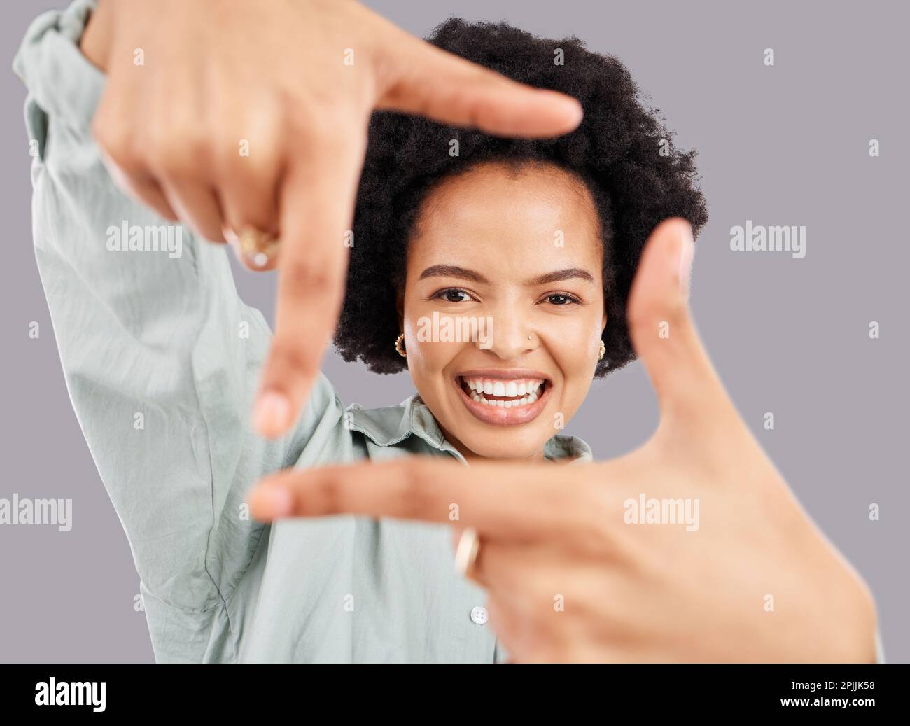 Happy, portrait and woman with hand frame in a studio posing with a ...