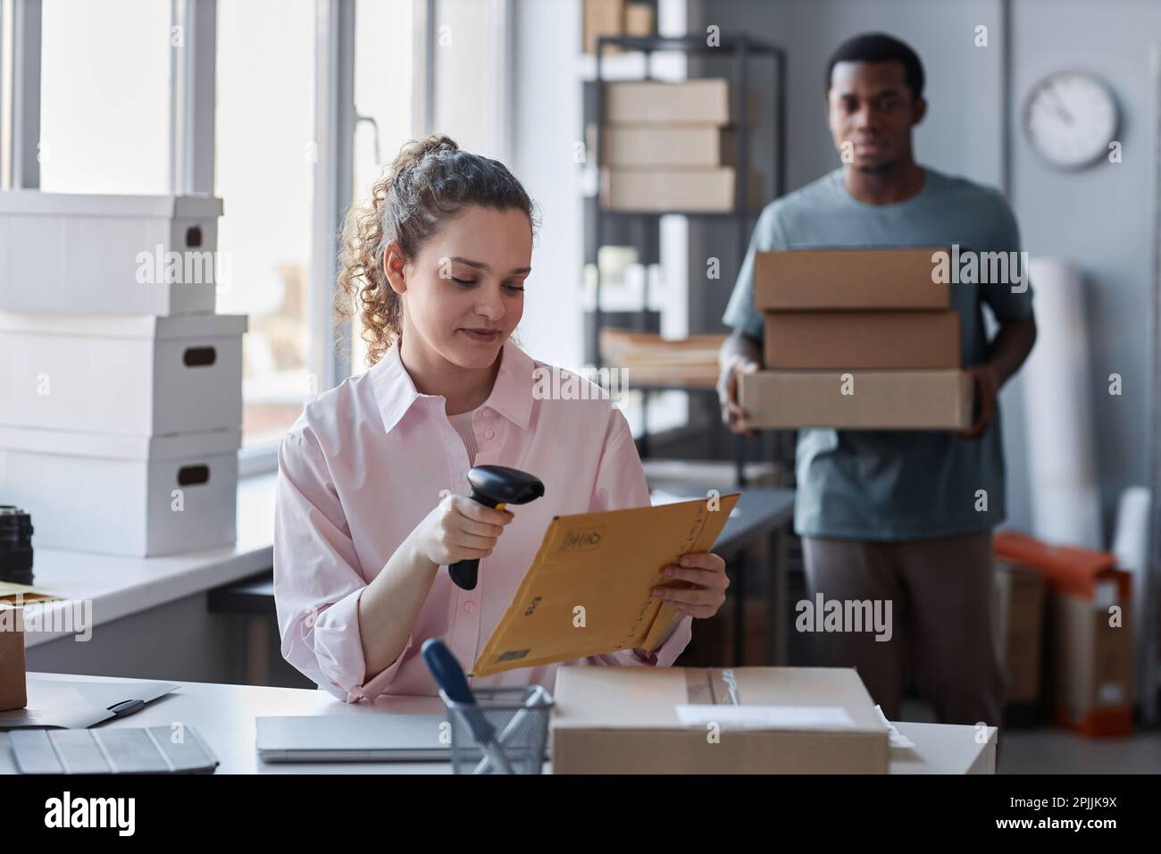 Worker scanning parcels in delivery hi-res stock photography and images ...