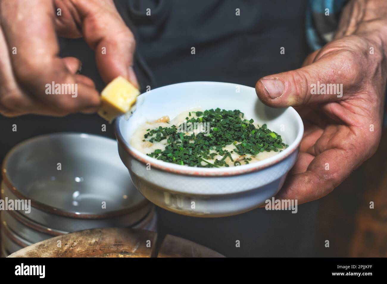 A rural dish made of stale bread and water with cheese and chives Stock ...