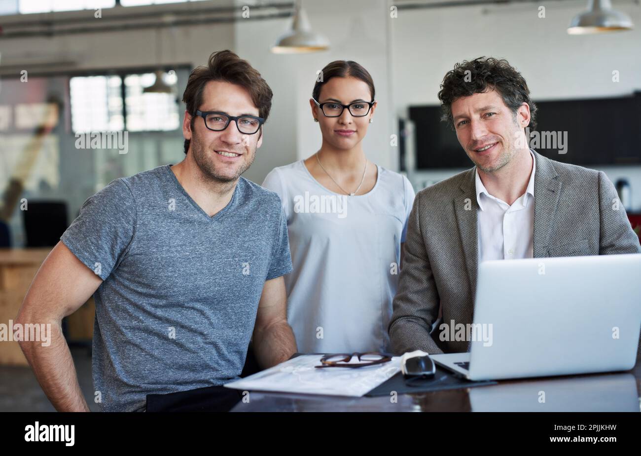 The number one creative team. Portrait of three business colleagues in ...