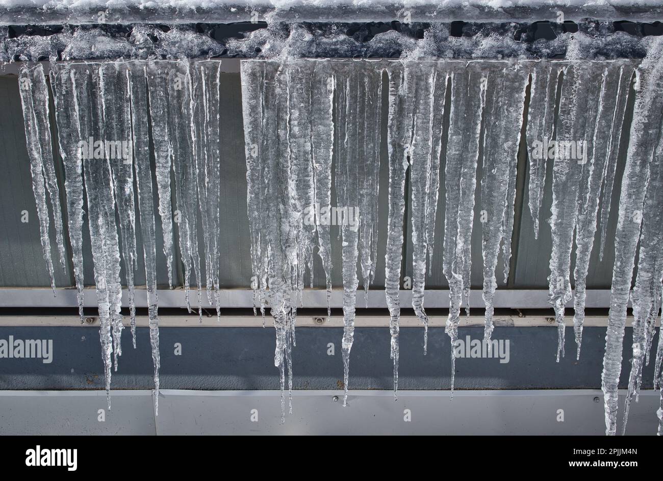 Melt water dripping from roof hi-res stock photography and images - Alamy