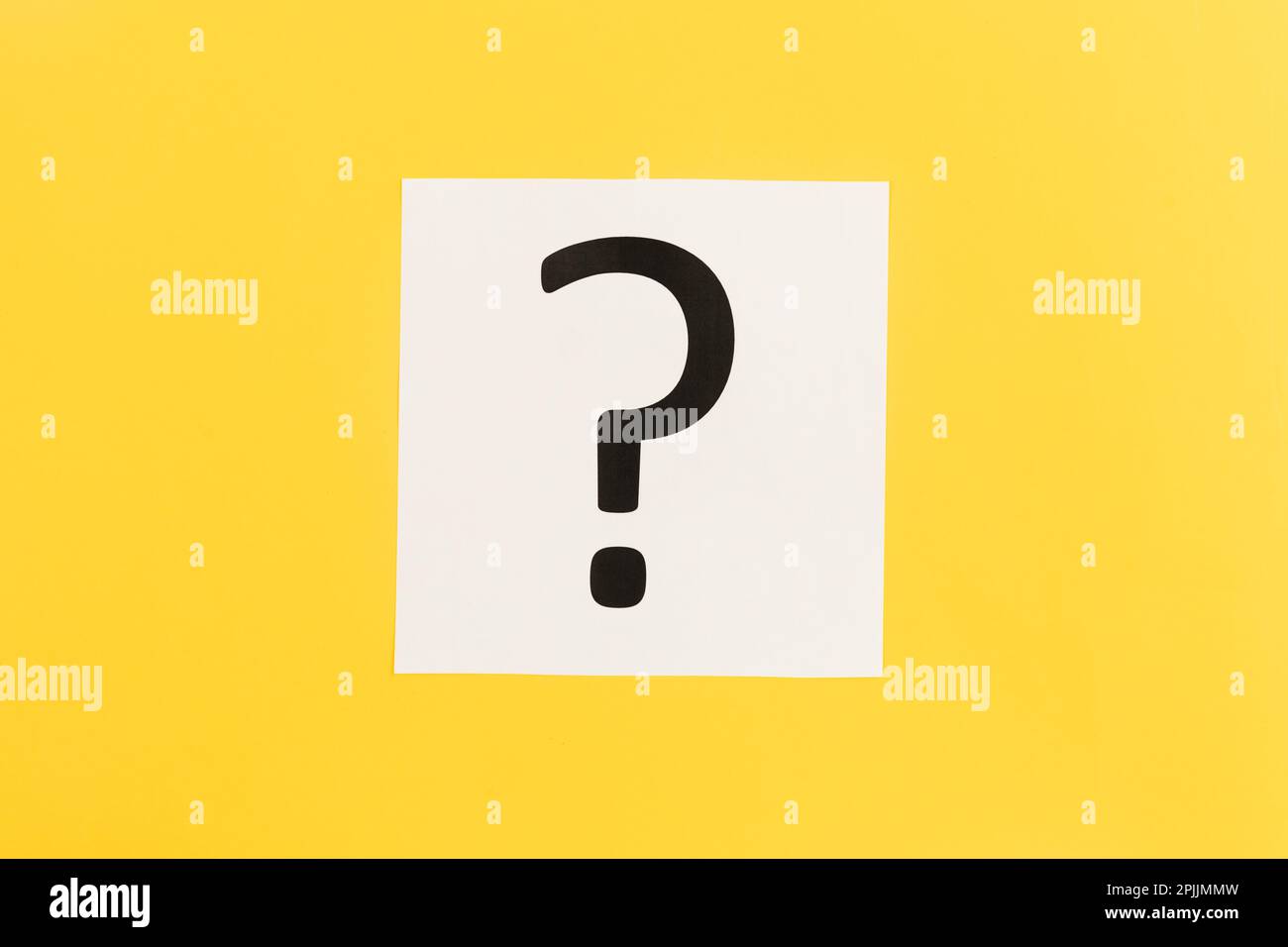 Question mark on white paper on yellow background, flat lay Stock Photo ...