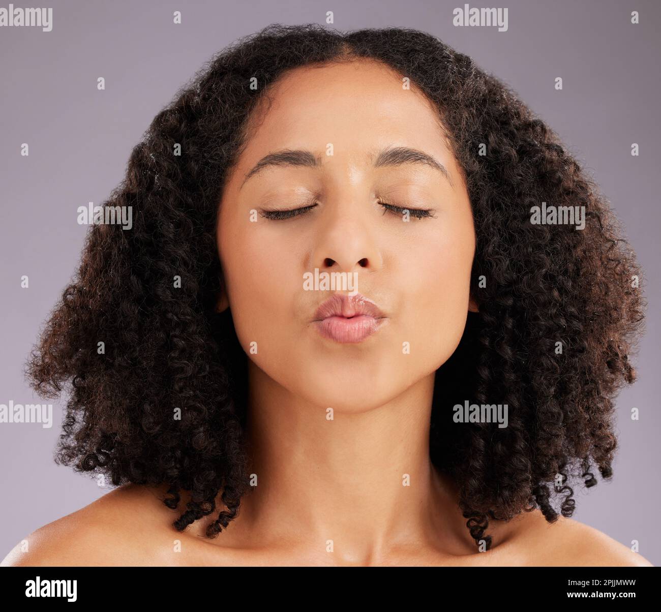 Woman, kiss face and beauty, flirt on studio background with ...